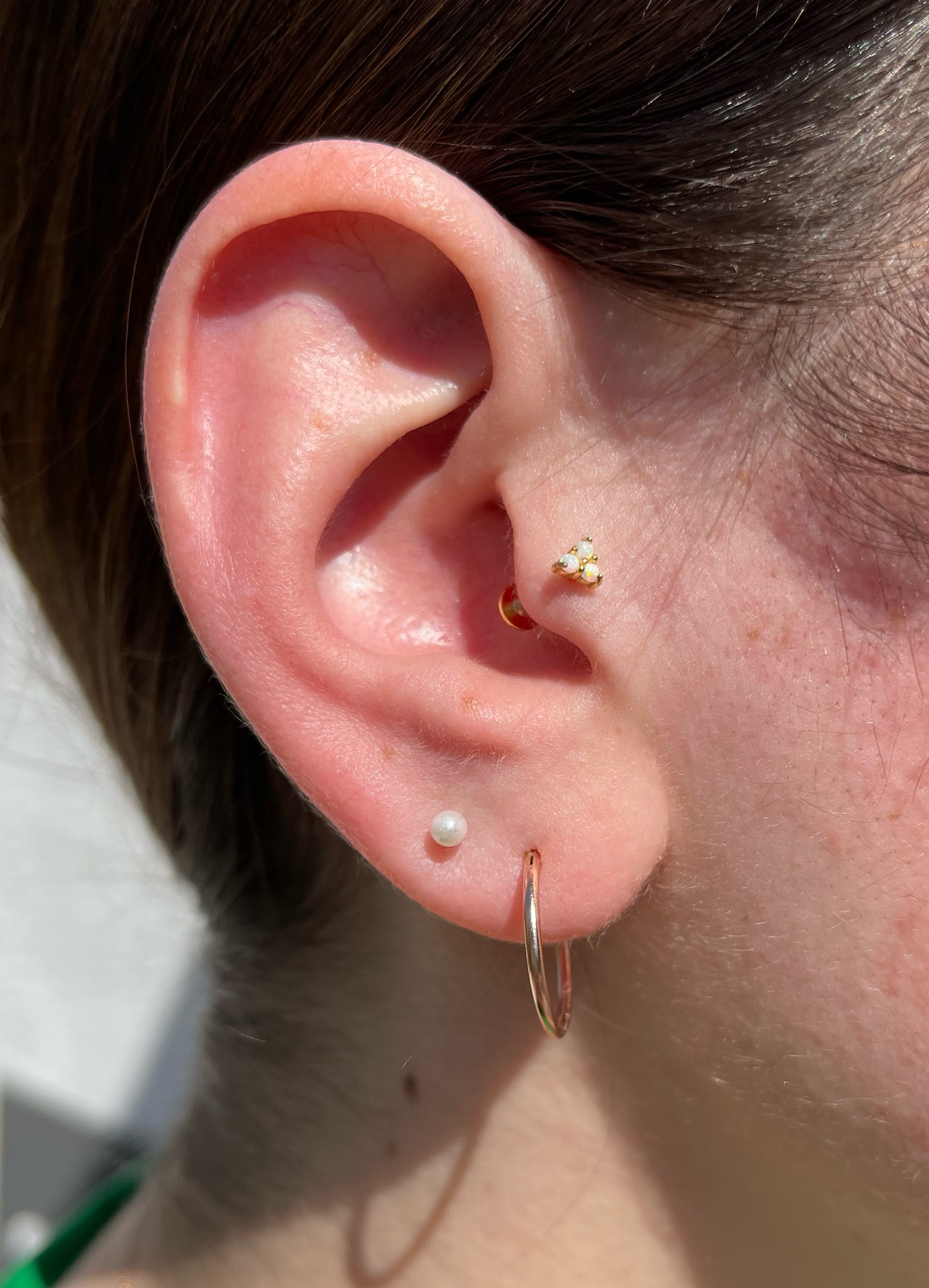 Piercing mini triángulo