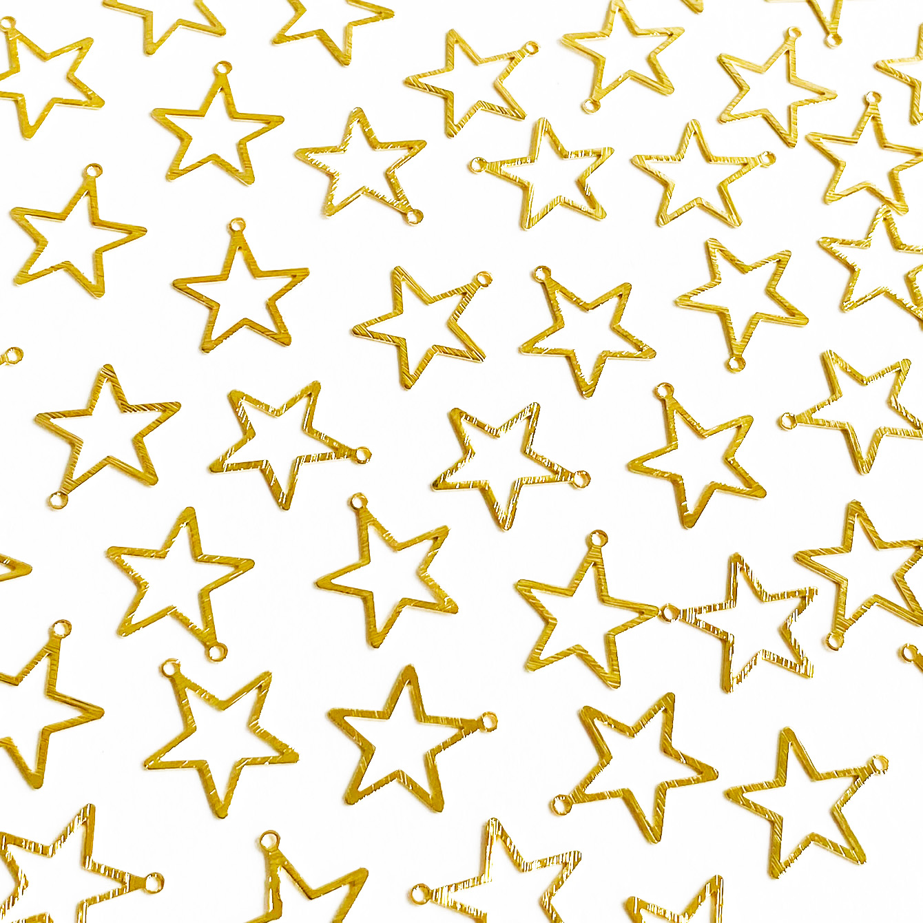 MINI DIJE ESTRELLA SILUETA LATÓN BAÑO DE ORO
